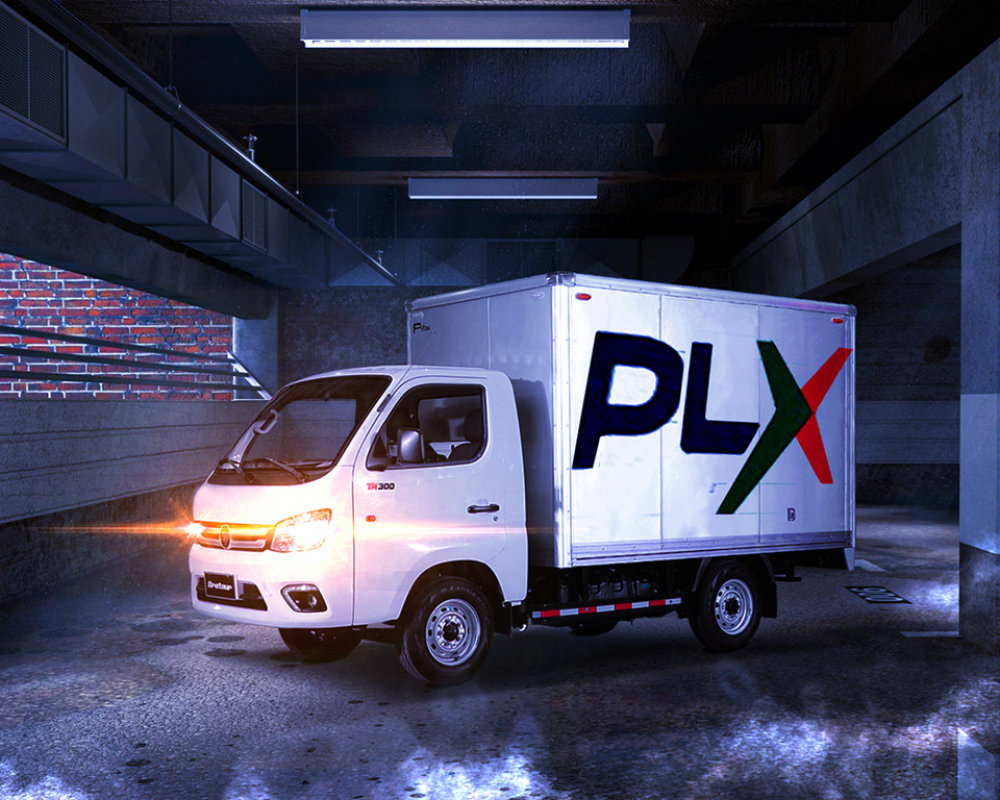 Futuristic delivery truck with "PLS" logo among sleek sports cars under ...